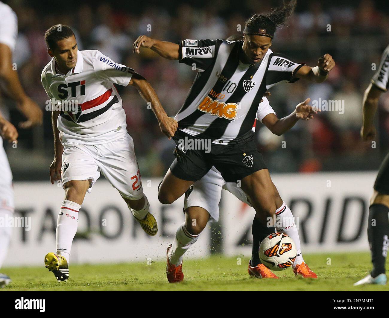 Ronaldinho of Brazil's Atletico Mineiro, right, fights for the ball ...