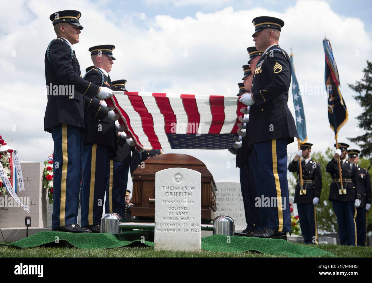 Army honor guards hold the American flag over the casket of Army Lt ...