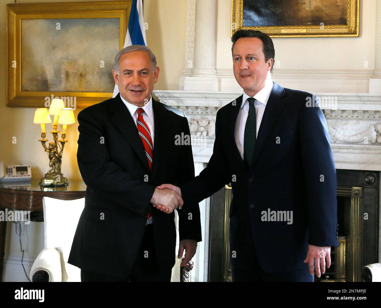 Britain's Prime Minister David Cameron, right, greets the Prime ...