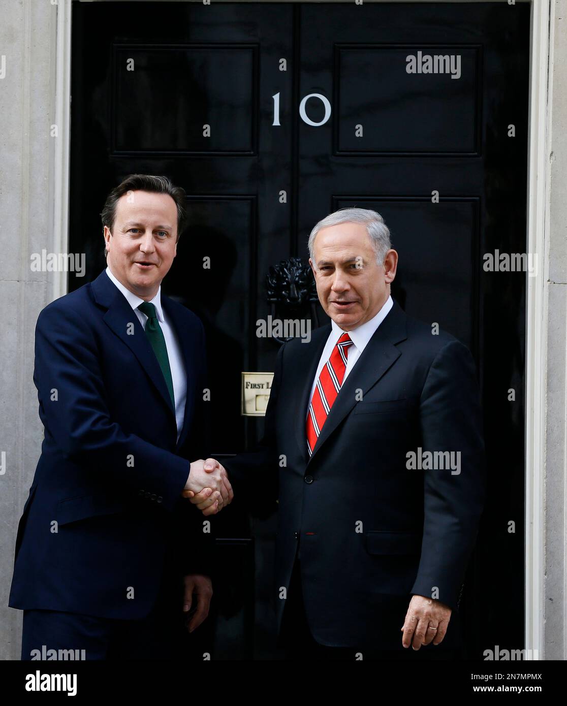 Britain's Prime Minister David Cameron, left, greets the Prime Minister ...
