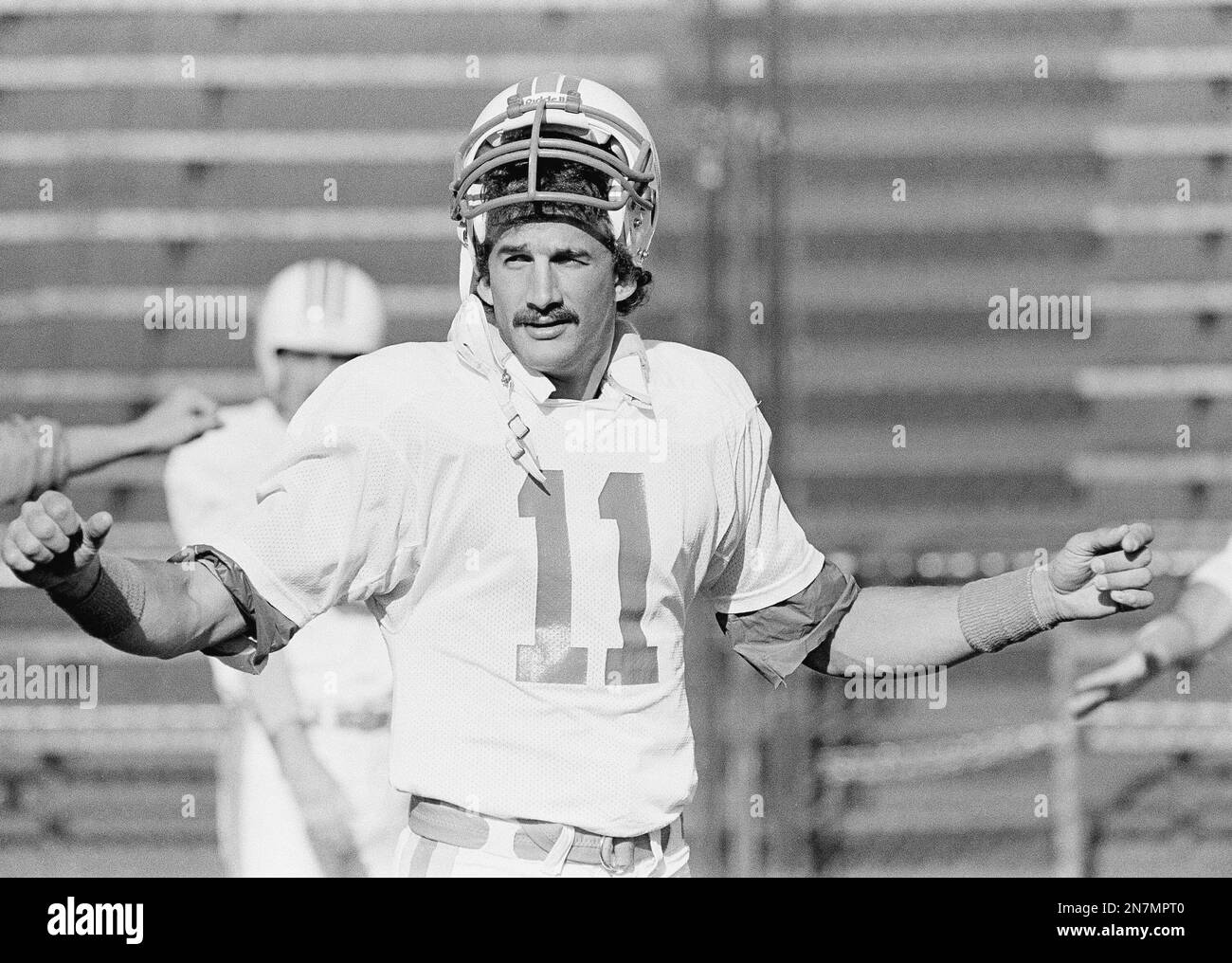 Miami Dolphins receiver Jim Jensen rotates his arm in a drill at the ...