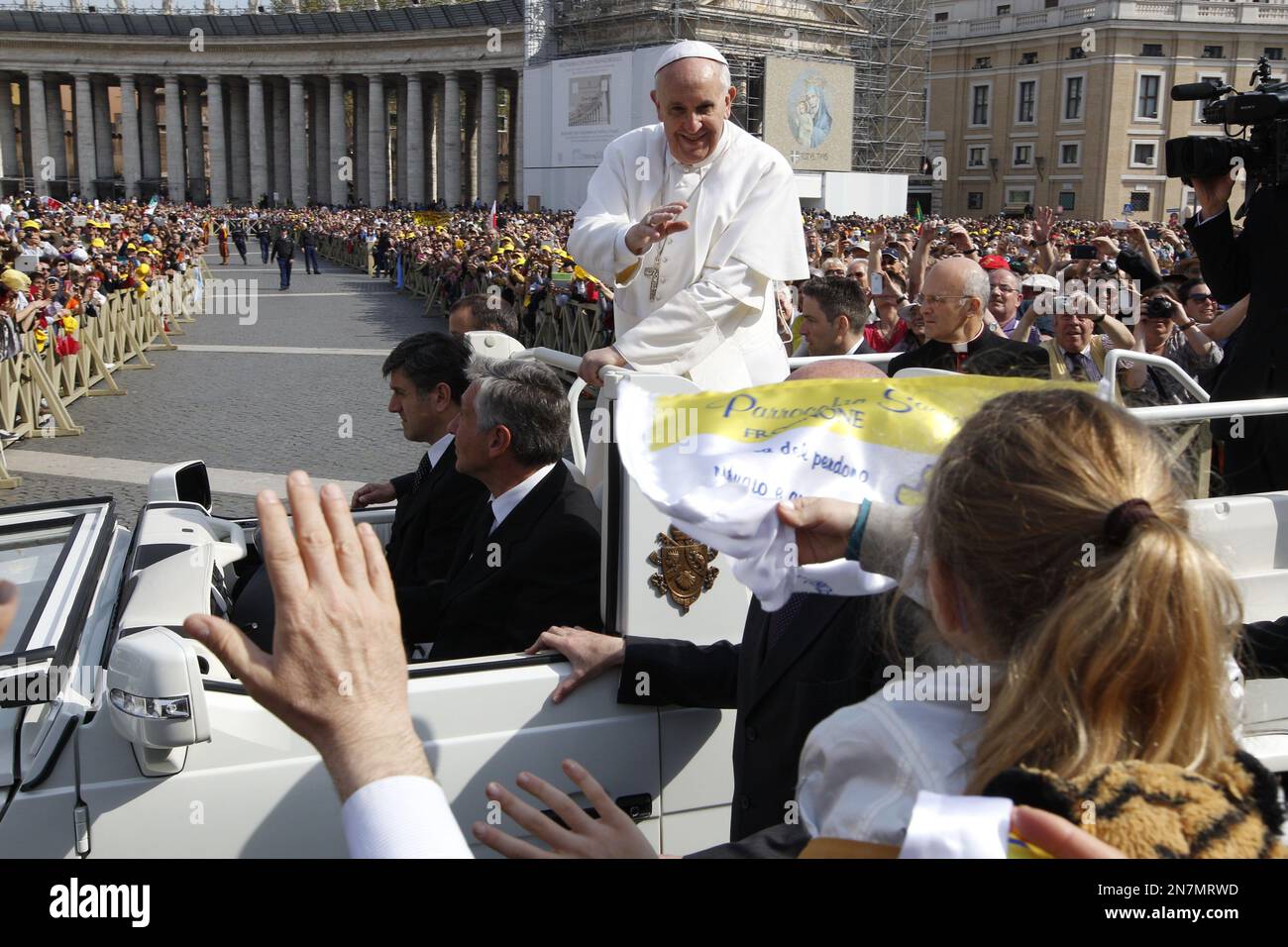 Pope Francis delivers his blessing as he arrives in St. Peter's Square ...