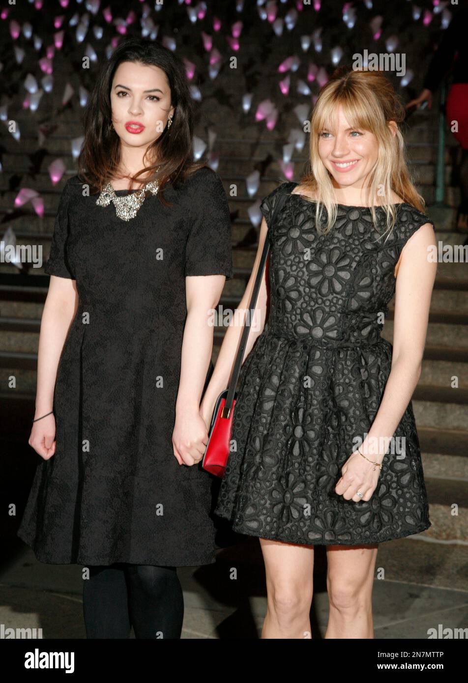 Actresses Matilda Sturridge, left, and Sienna Miller, right, attend the ...