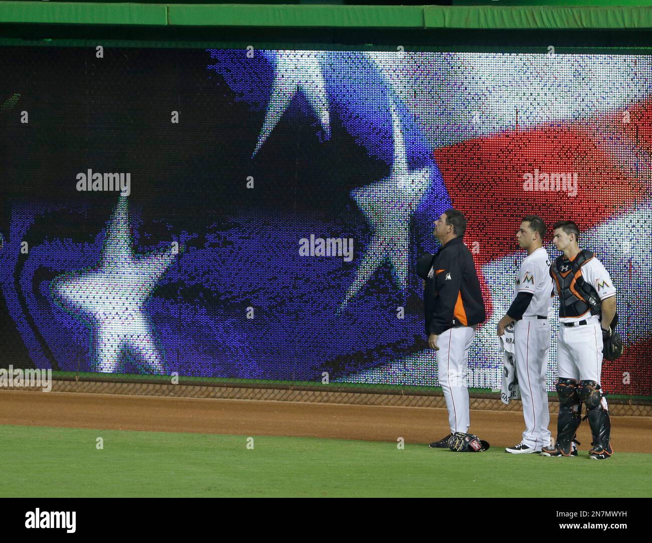 Miami Marlins pitching coach Chuck Hernandez, left, starting pitcher ...
