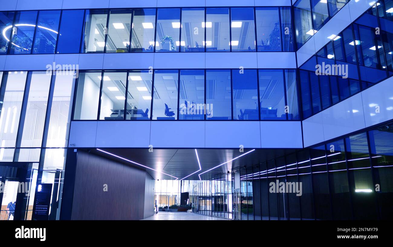 Modern office building in city at the night. View on illuminated ...