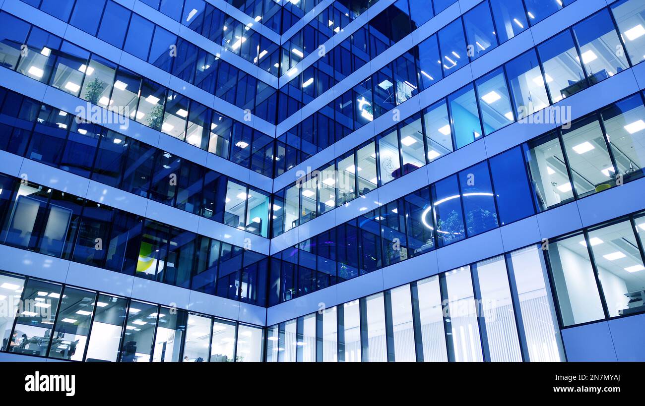 Modern office building in city at the night. View on illuminated ...