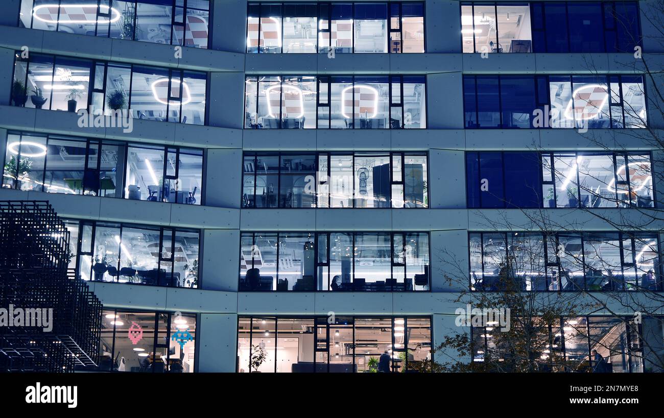Modern office building in city at the night. View on illuminated ...
