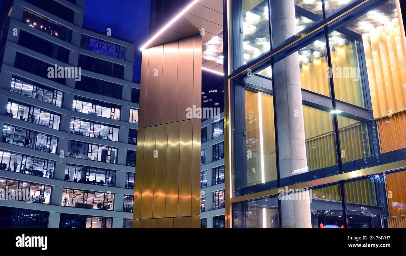 Modern office building in city at the night. View on illuminated ...