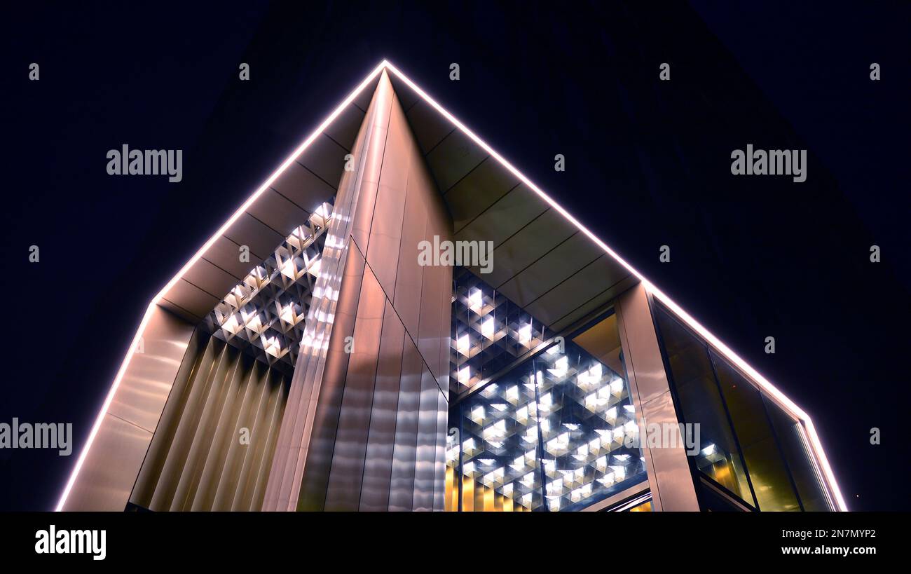 Modern office building in city at the night. View on illuminated ...