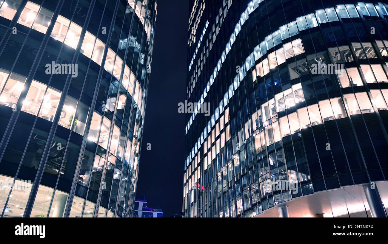 Modern office building in city at the night. View on illuminated ...