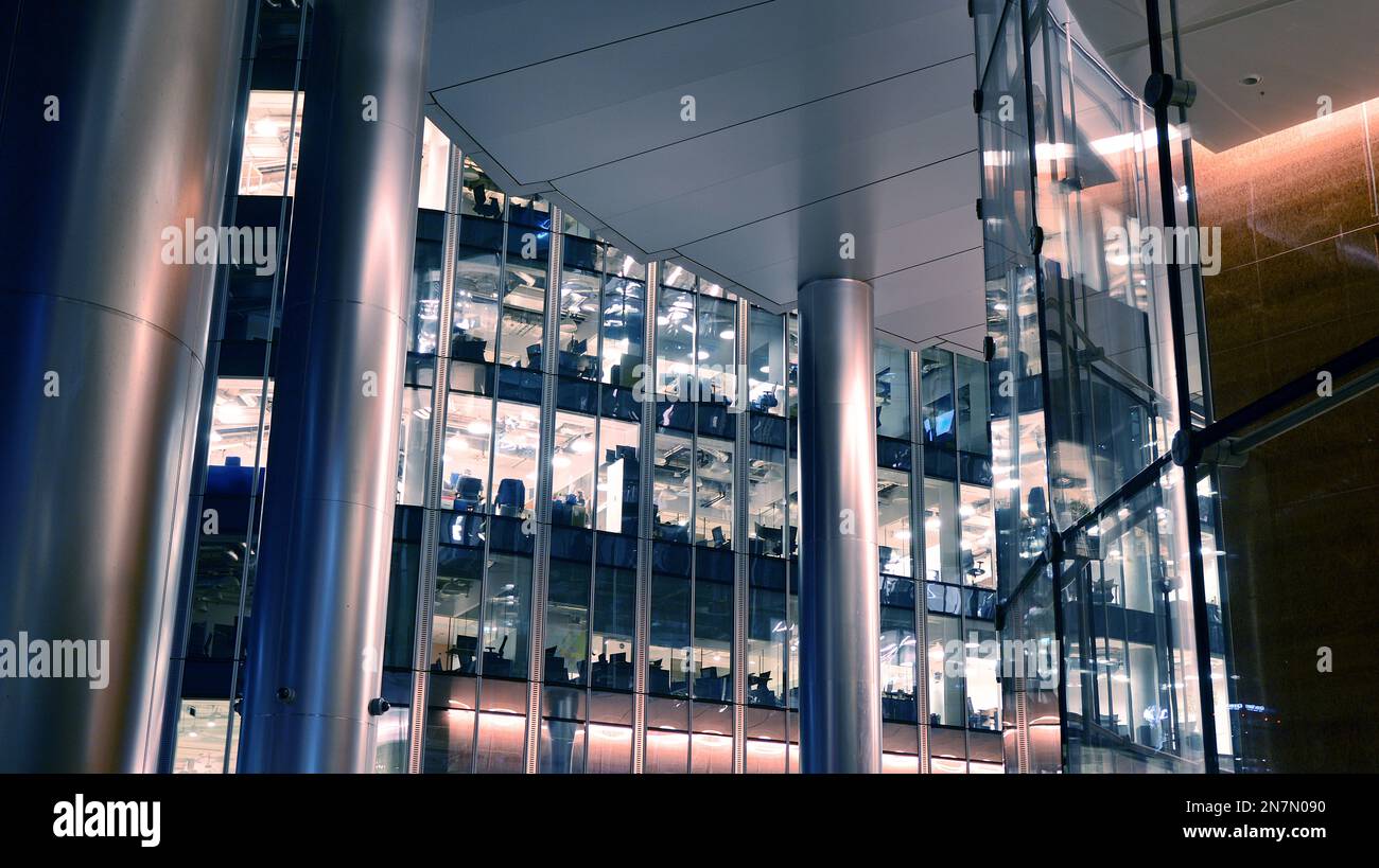 Modern office building in city at the night. View on illuminated ...