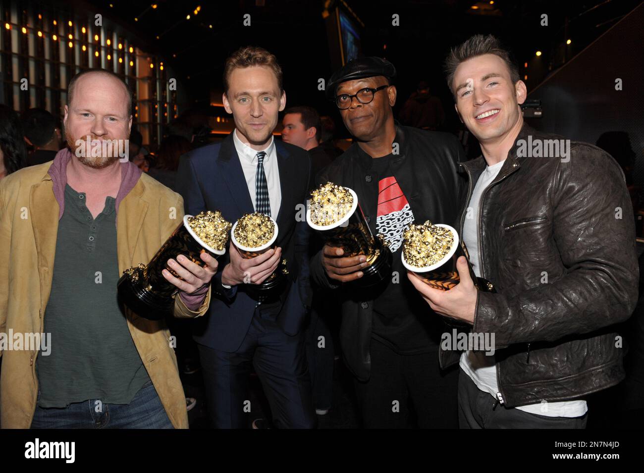 From left, Actor Tom Hiddleston, director Joss Whedon, Chris Evans and ...