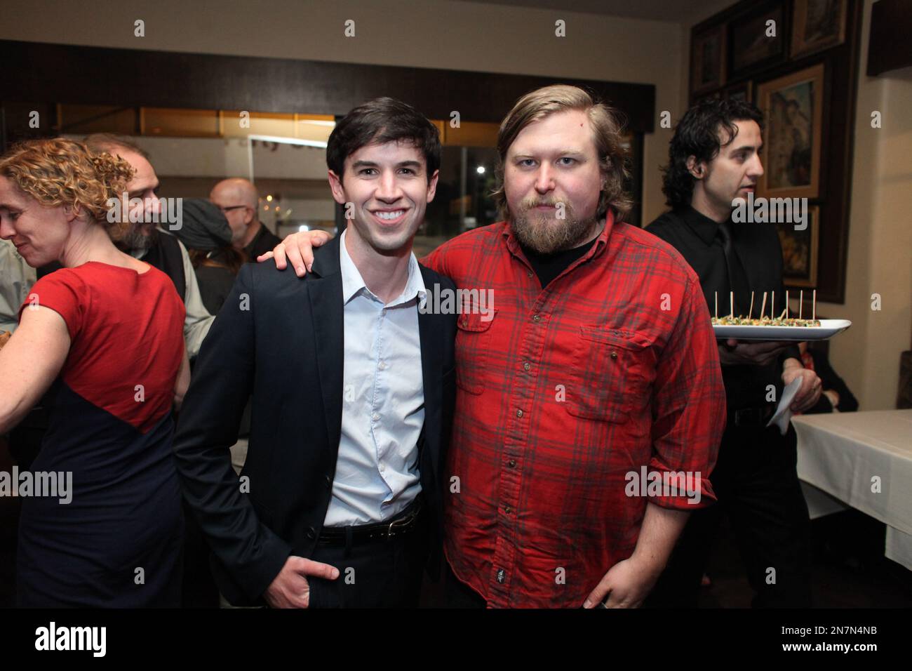 From left, actor Wyatt Fenner and Michael Chernus pose during the party ...