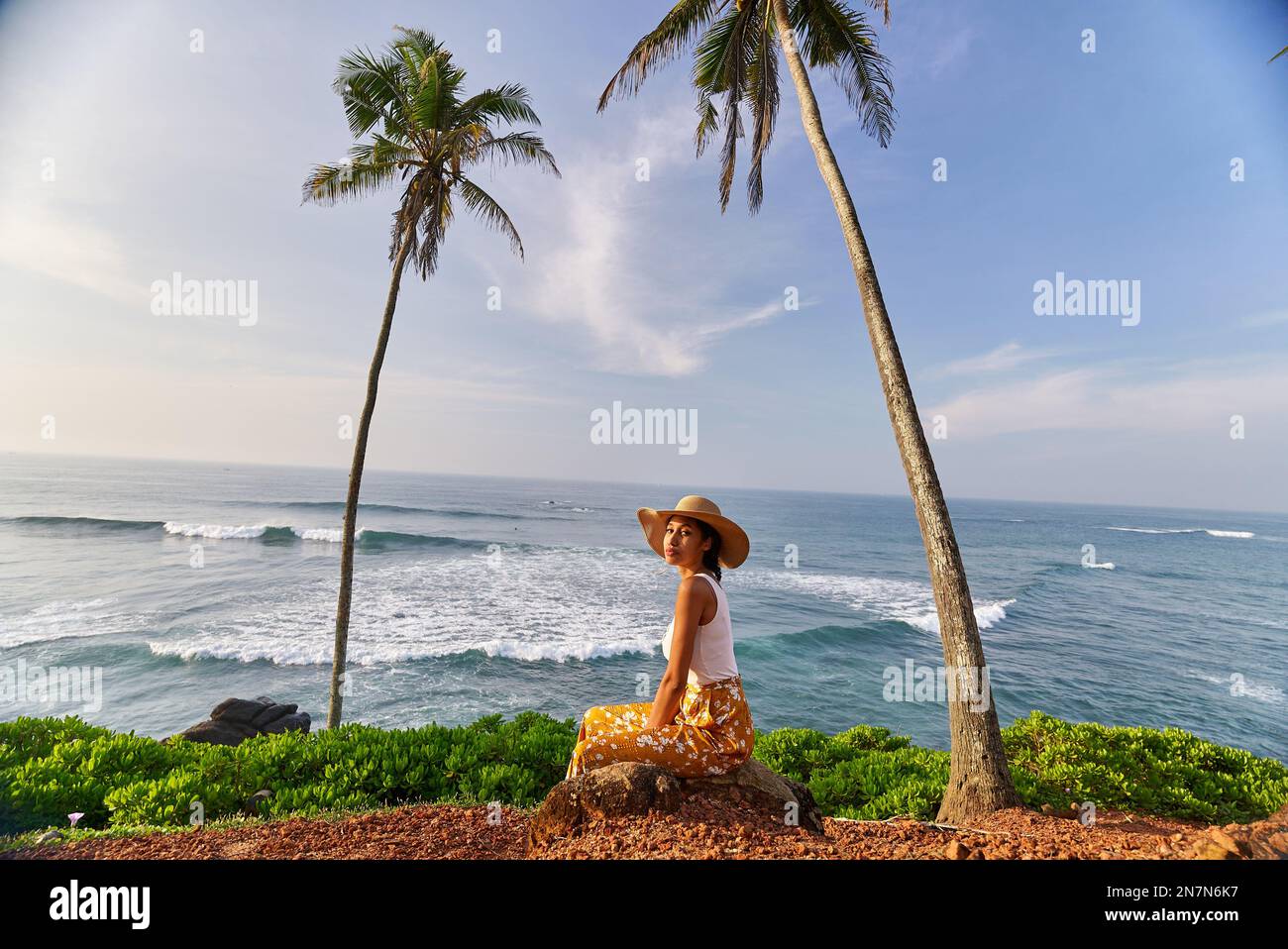 Young african female model posing in colorful clothes at scenic ...