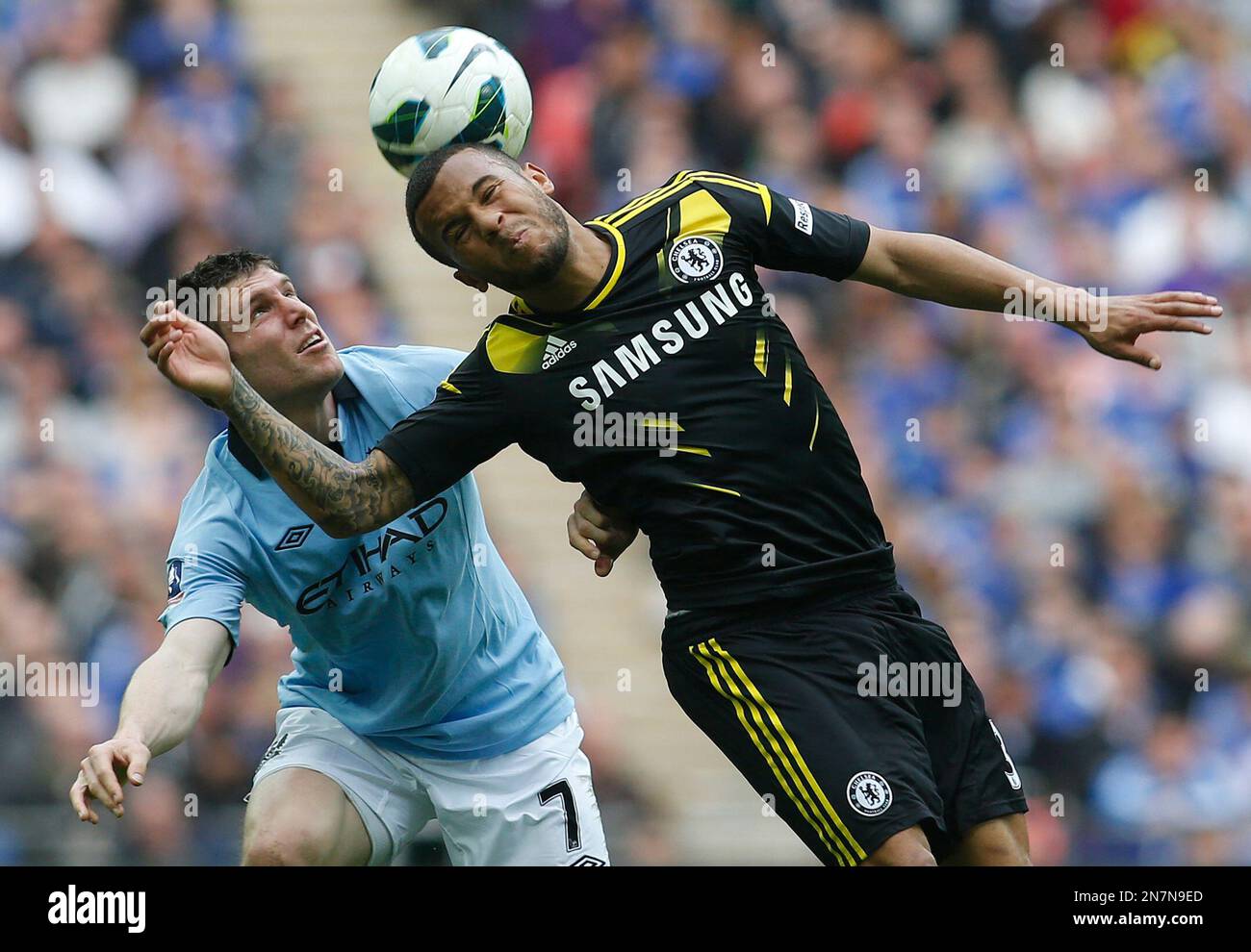 Chelsea's Ryan Bertrand, right head the ball under pressure from ...