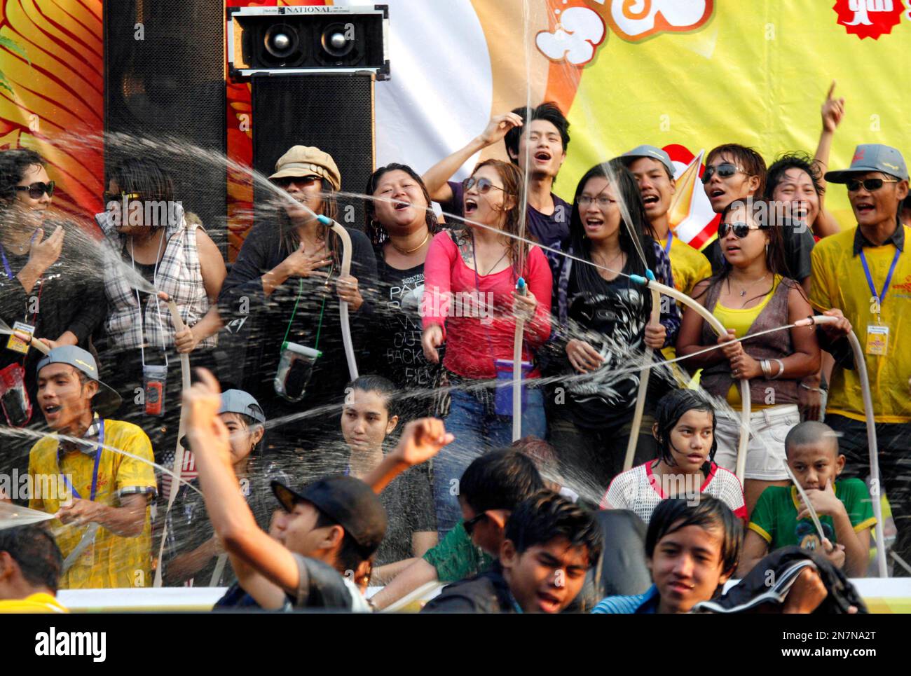 Revelers spray water from a pavilion during the traditional Thingyan ...