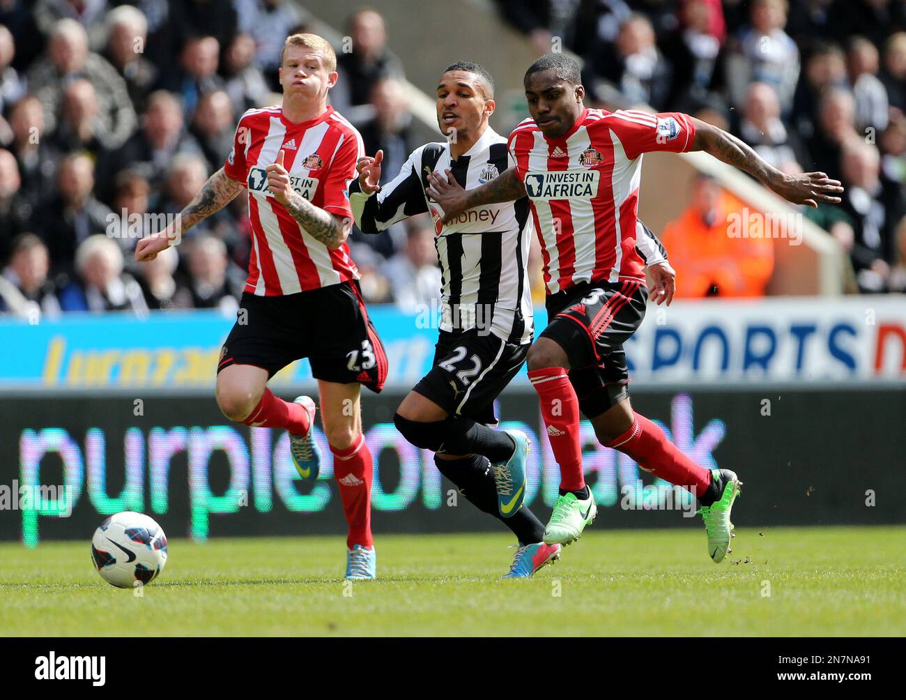 Newcastle United's Sylvain Marveaux, center, vies for the ball with ...