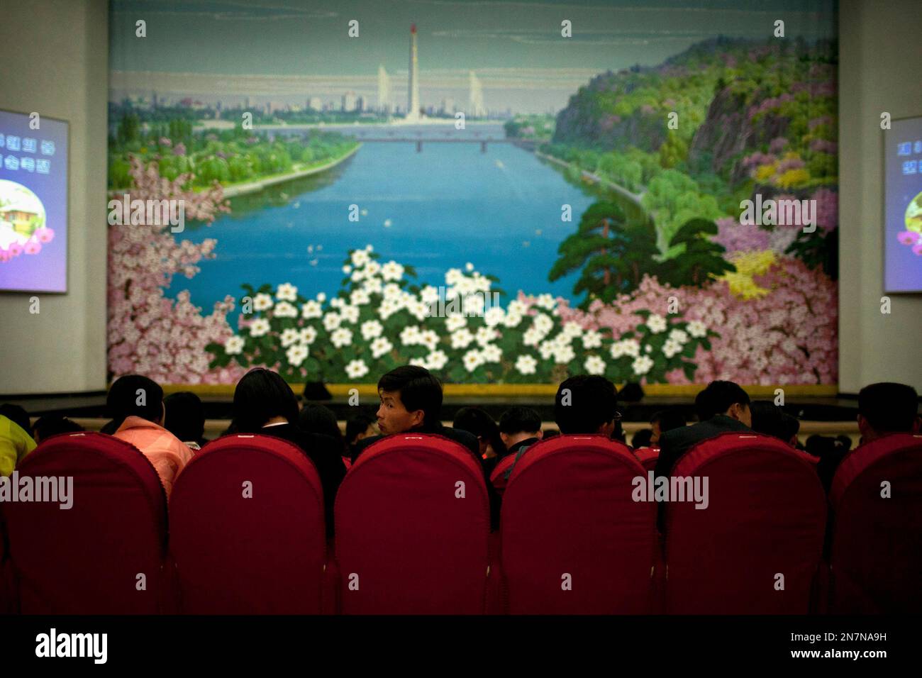 A man looks back on his seat while waiting for a performance to ...