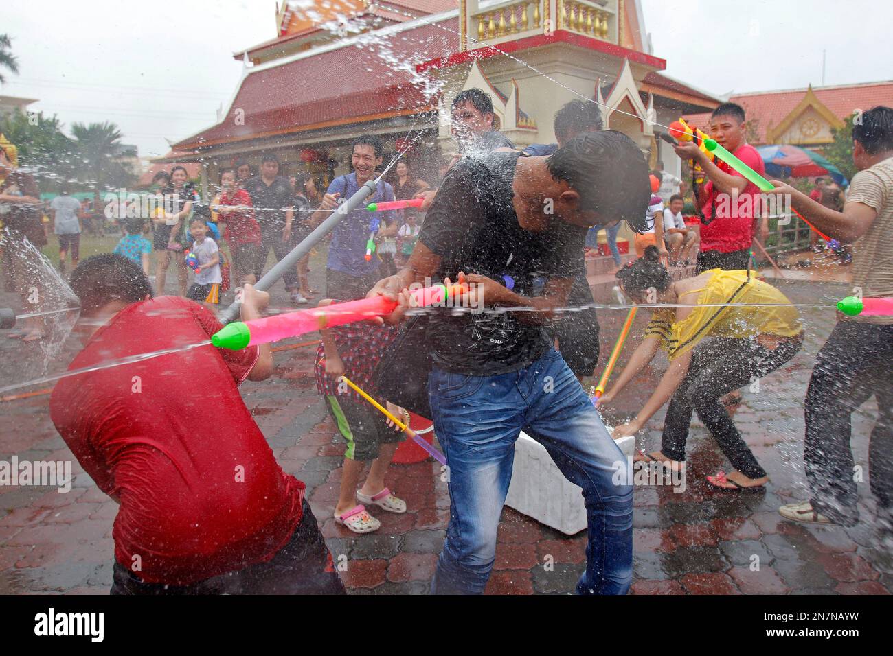 People shoot each other with water guns as they celebrate the Songkran festival, the Thai ...