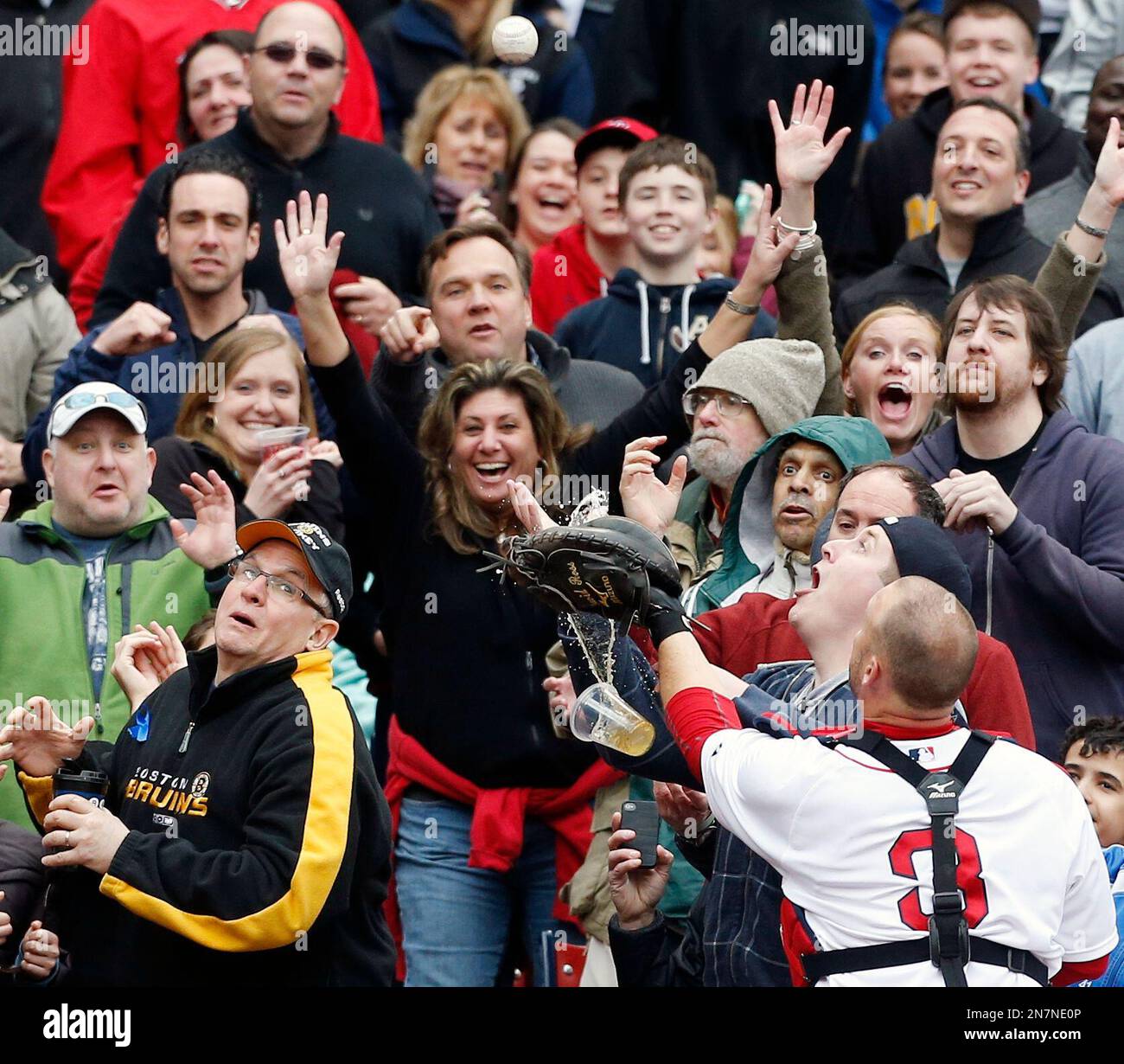 Boston Red Sox catcher David Ross (3) reaches into the crowd for the ...
