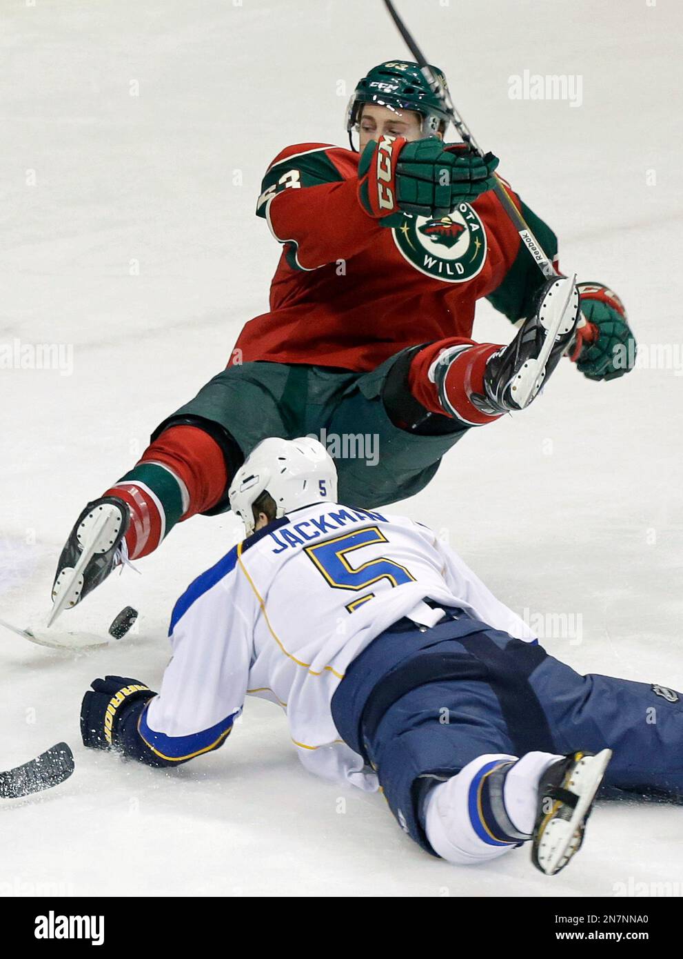 Minnesota Wild's Charlie Coyle, top, is upended by St. Louis Blues ...