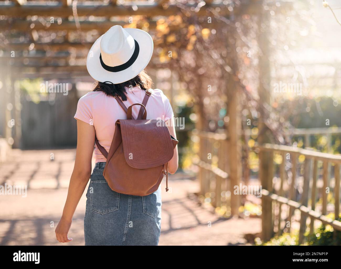 Back, woman and travel for summer, outdoor and walking for sightseeing ...