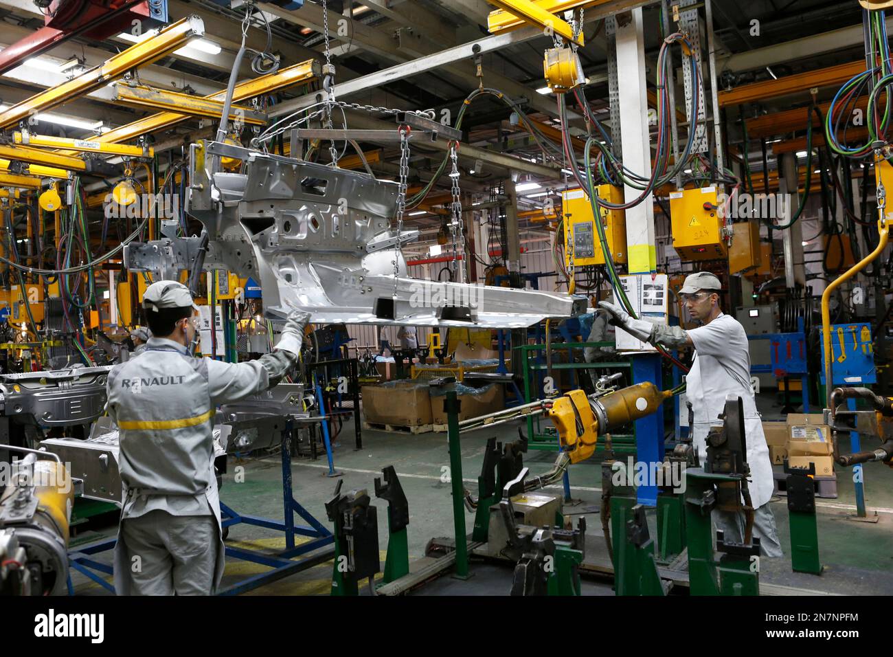 Workers at the assembly line of the new Dacia Sandero car at the Somaca ...