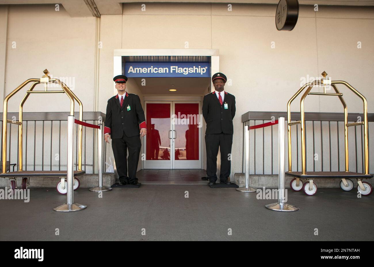 In this Thursday, March 14, 2013 photo, American Airlines skycaps Alex ...