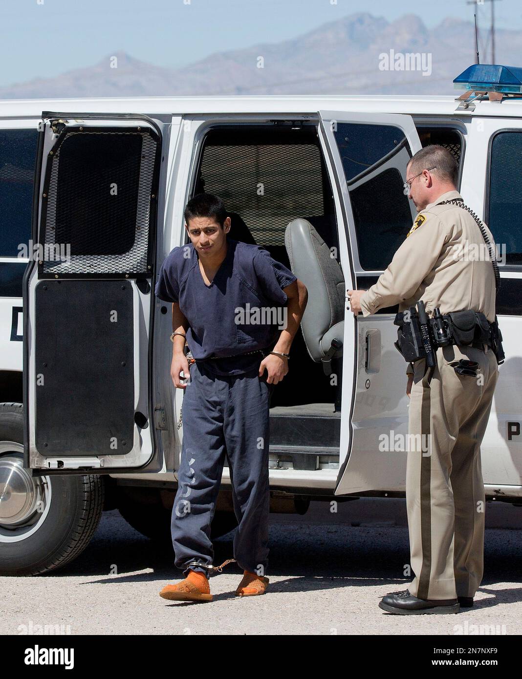 Jean Ervin Soriano steps out of a van upon arriving at Moapa District ...