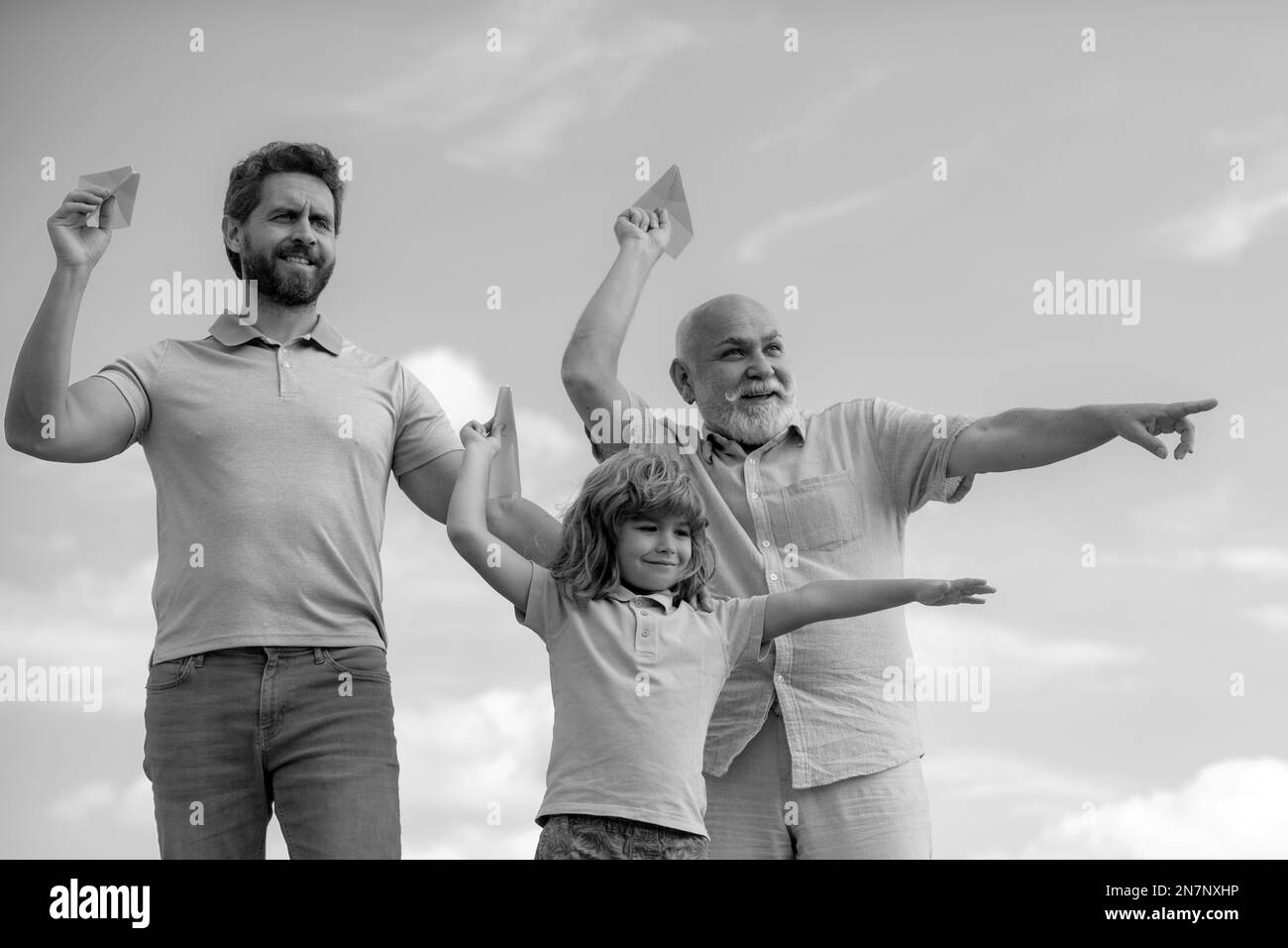 Fathers day. Kid having fun with toy plane. Men generation family with ...