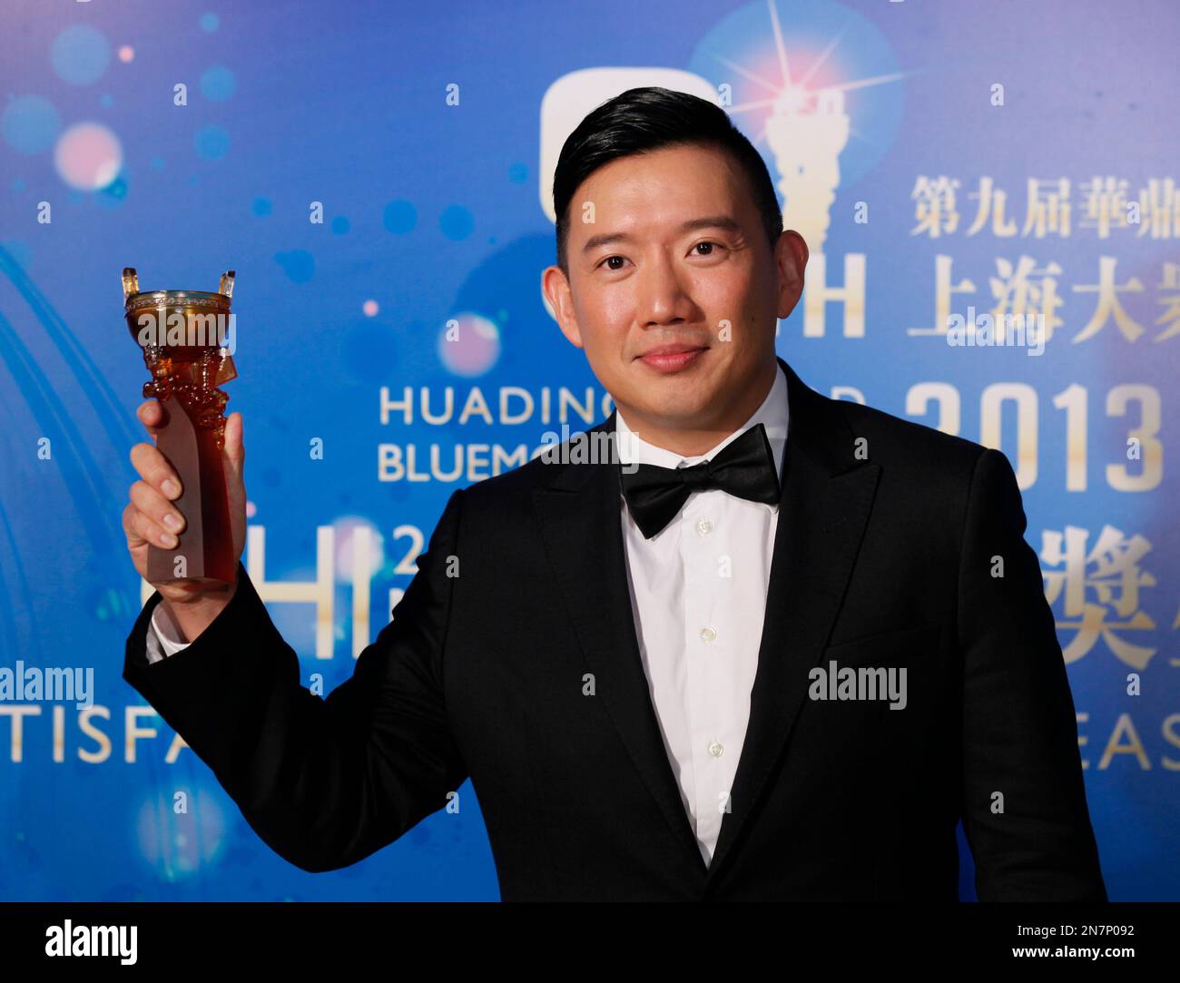Hong Kong actor Chapman To poses after winning the Best Supporting ...