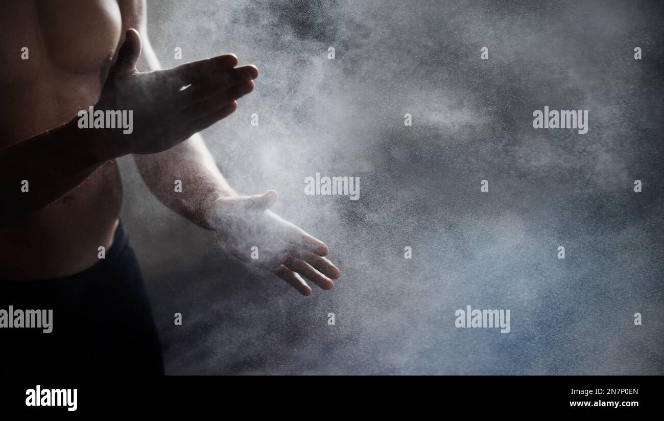 Magnesium, chalk and bodybuilder hands preparing for a workout or ...