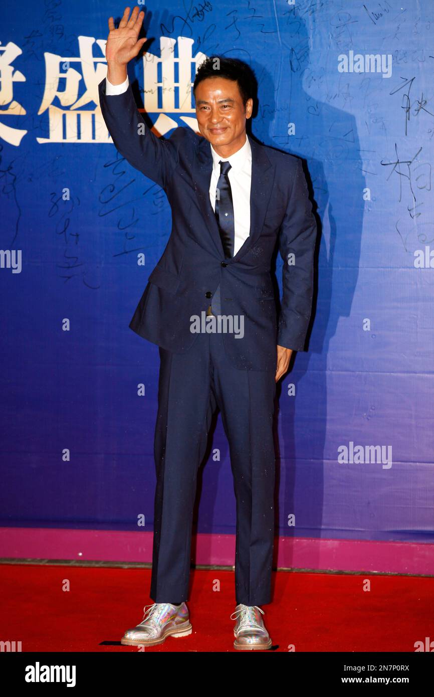 Hong Kong actor Simon Yam poses on the red carpet at the Huading Awards ...