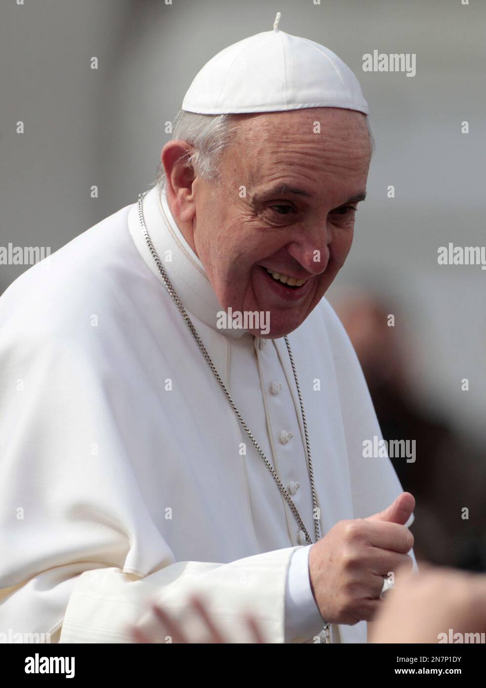 Pope Francis gives the thumbs up to faithful as he is driven through ...