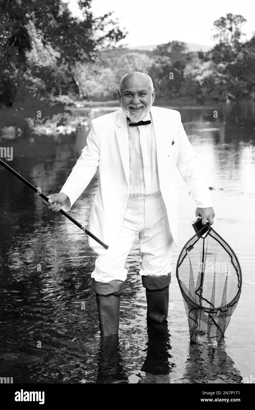 Portrait of cheerful bearded man fishing. Catching and fishing. Fisher ...
