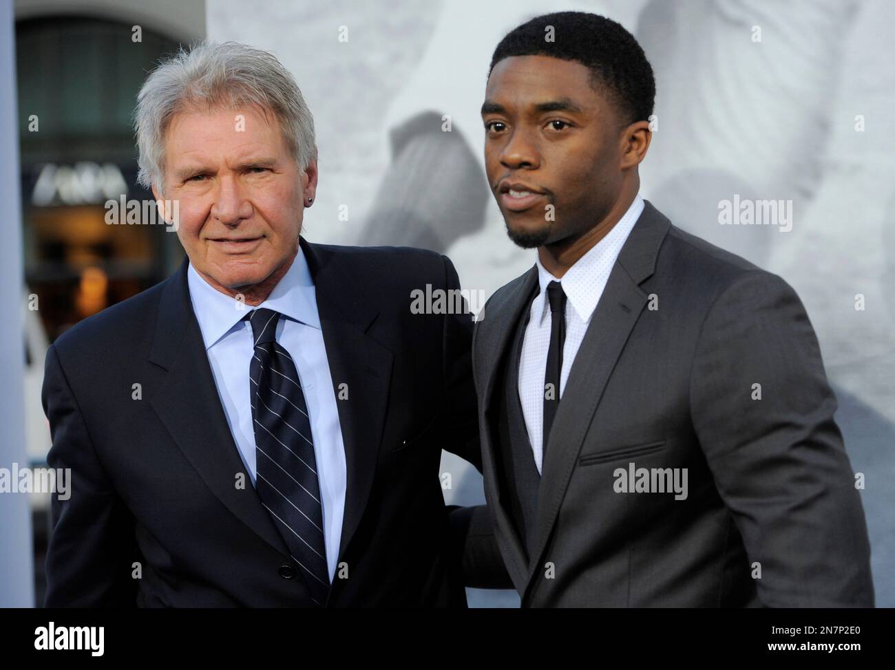 Harrison Ford, left, and Chadwick Boseman, cast members in "42," pose ...