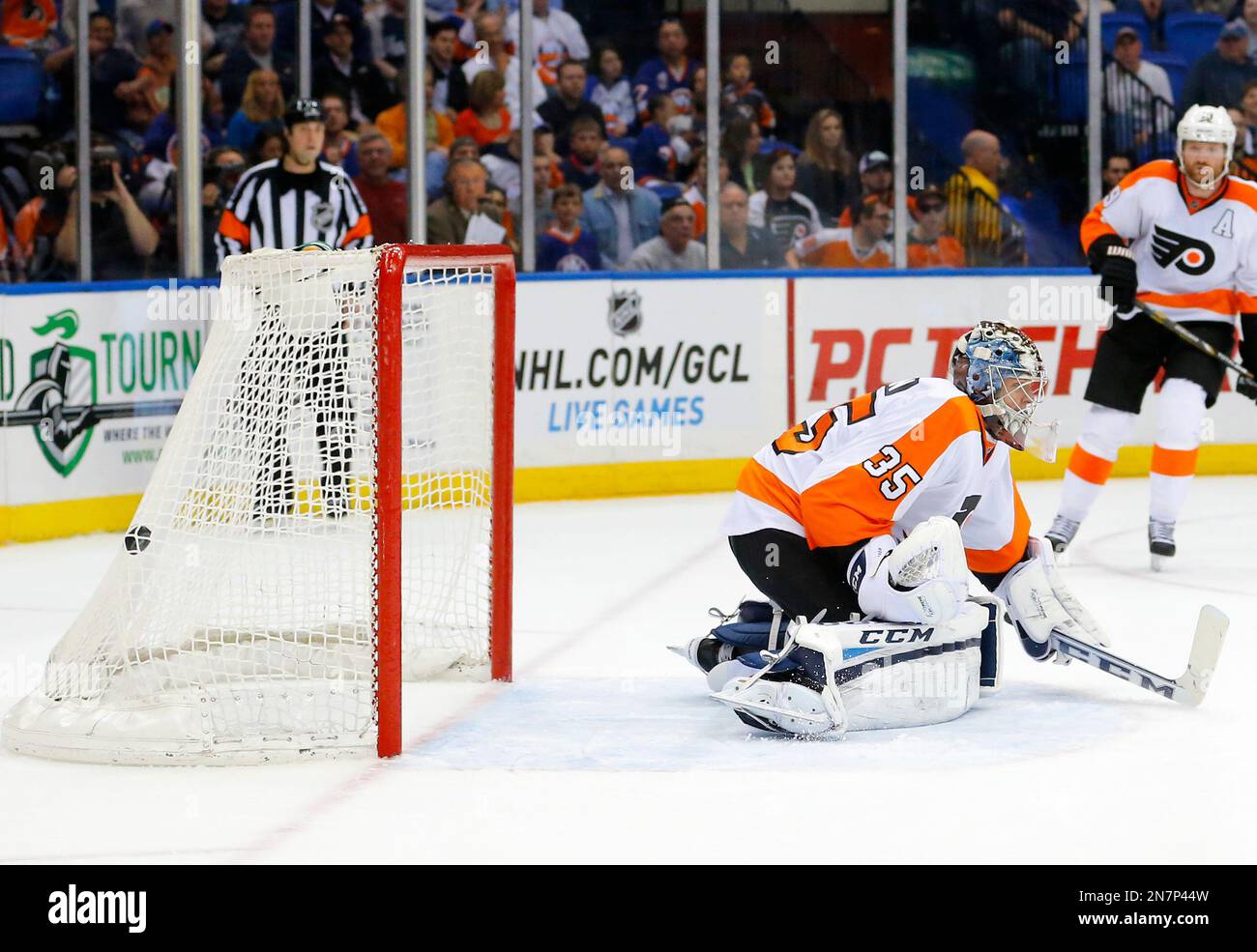 Philadelphia Flyers goalie Steve Mason (35) misses a shot by New York ...