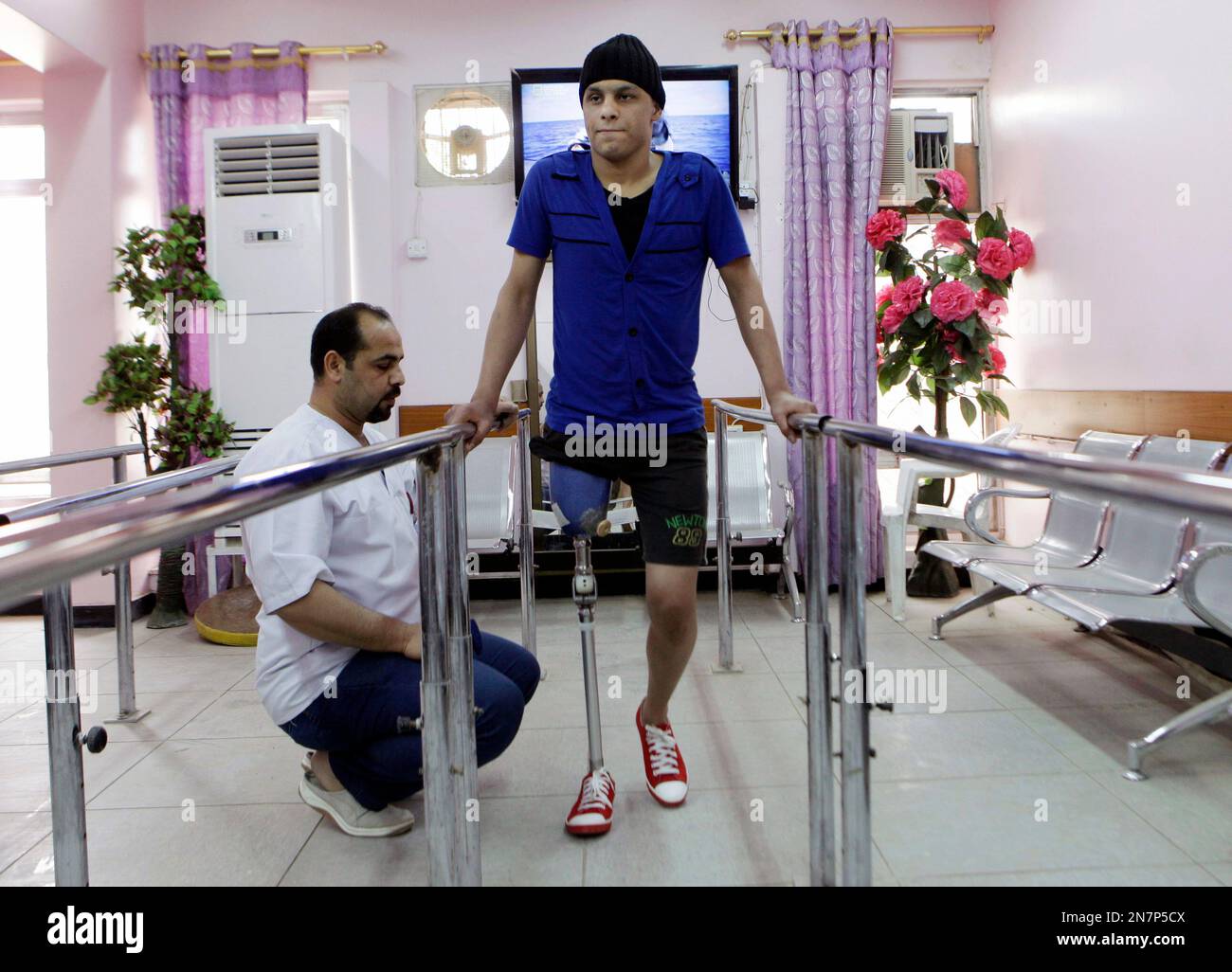 Hassan karim, tries his new prosthetic leg at the prosthetic limbs ...