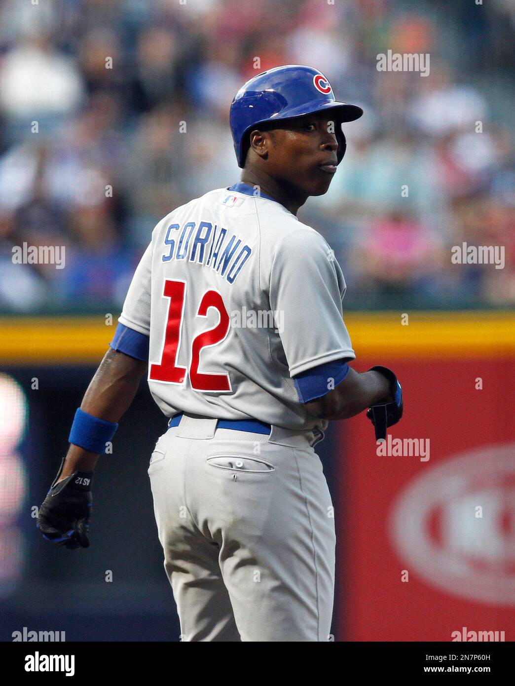 Chicago Cubs' Alfonso Soriano looks for the throw after a stand up ...