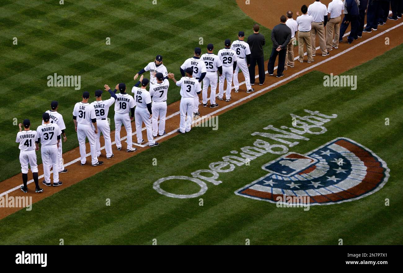 Seattle Mariners players line-up during introductions before a baseball ...