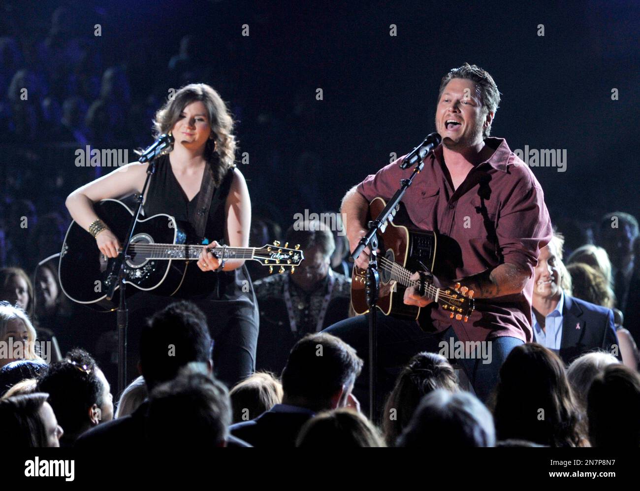 Blake Shelton, right, performs at the 48th Annual Academy of Country ...
