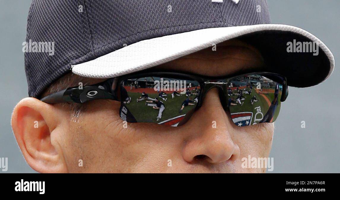 New York Yankees manager Joe Girardi watches his team stretch before ...