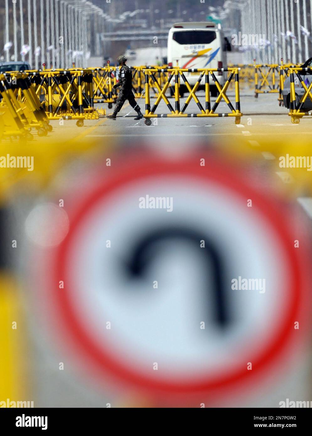 A South Korean Army soldier controls traffic at the barricaded ...