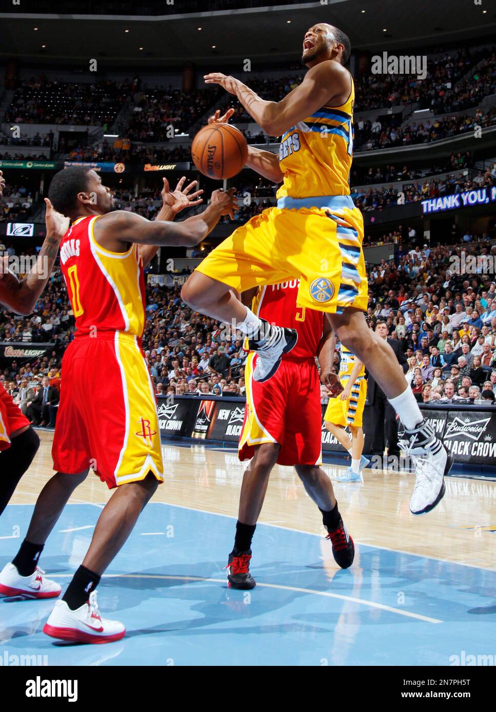 Denver Nuggets forward Anthony Randolph, right, loses control of the ...