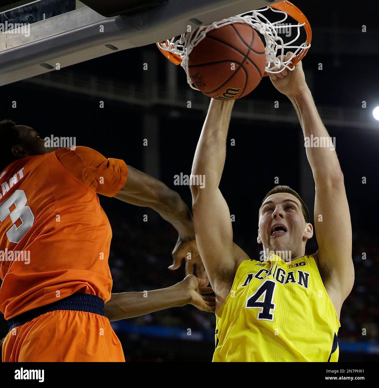 Michigan's Mitch McGary (4) dunks the ball against Syracuse's Jerami ...