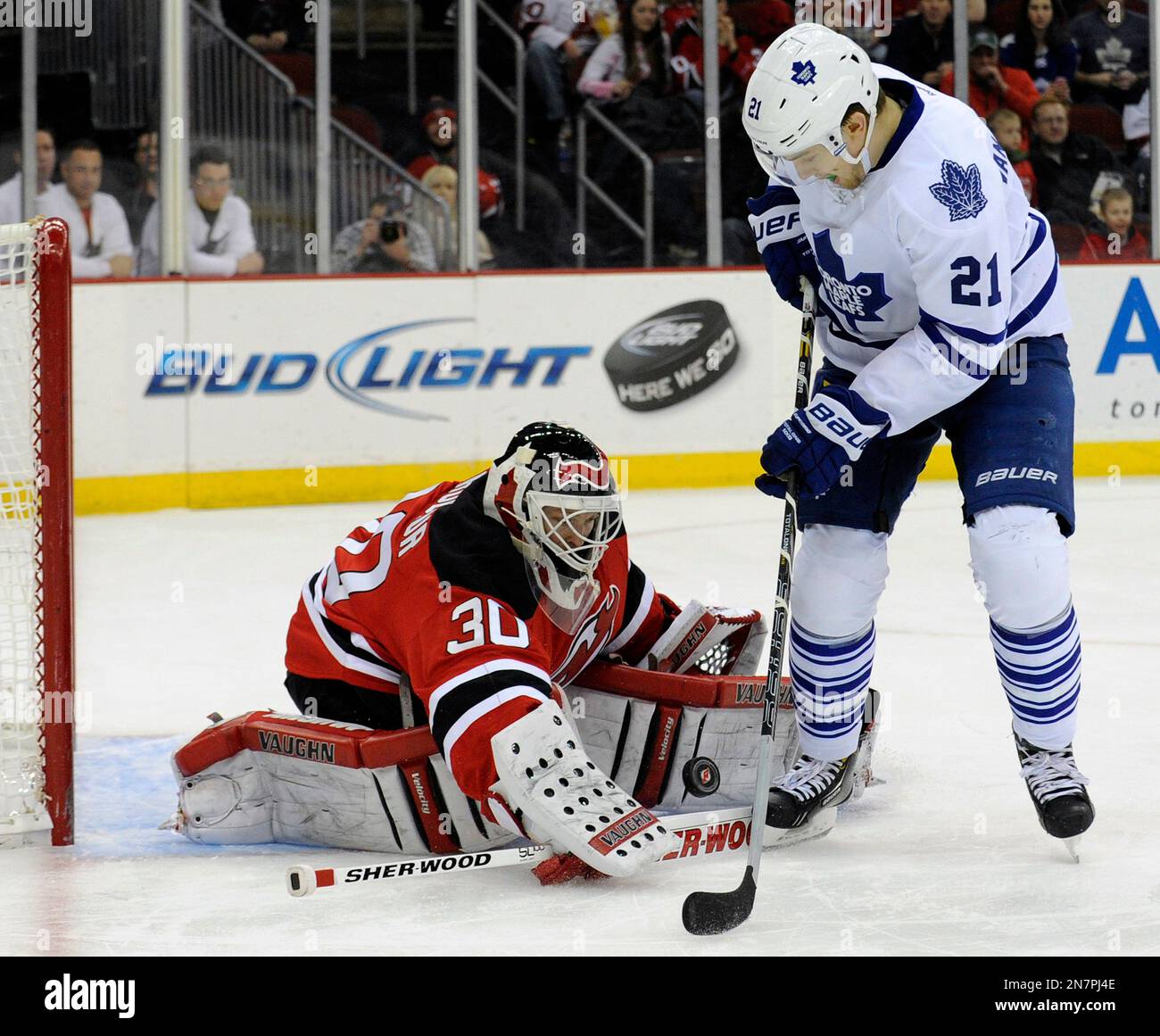 New Jersey Devils goaltender Martin Brodeur, left, makes a save as ...