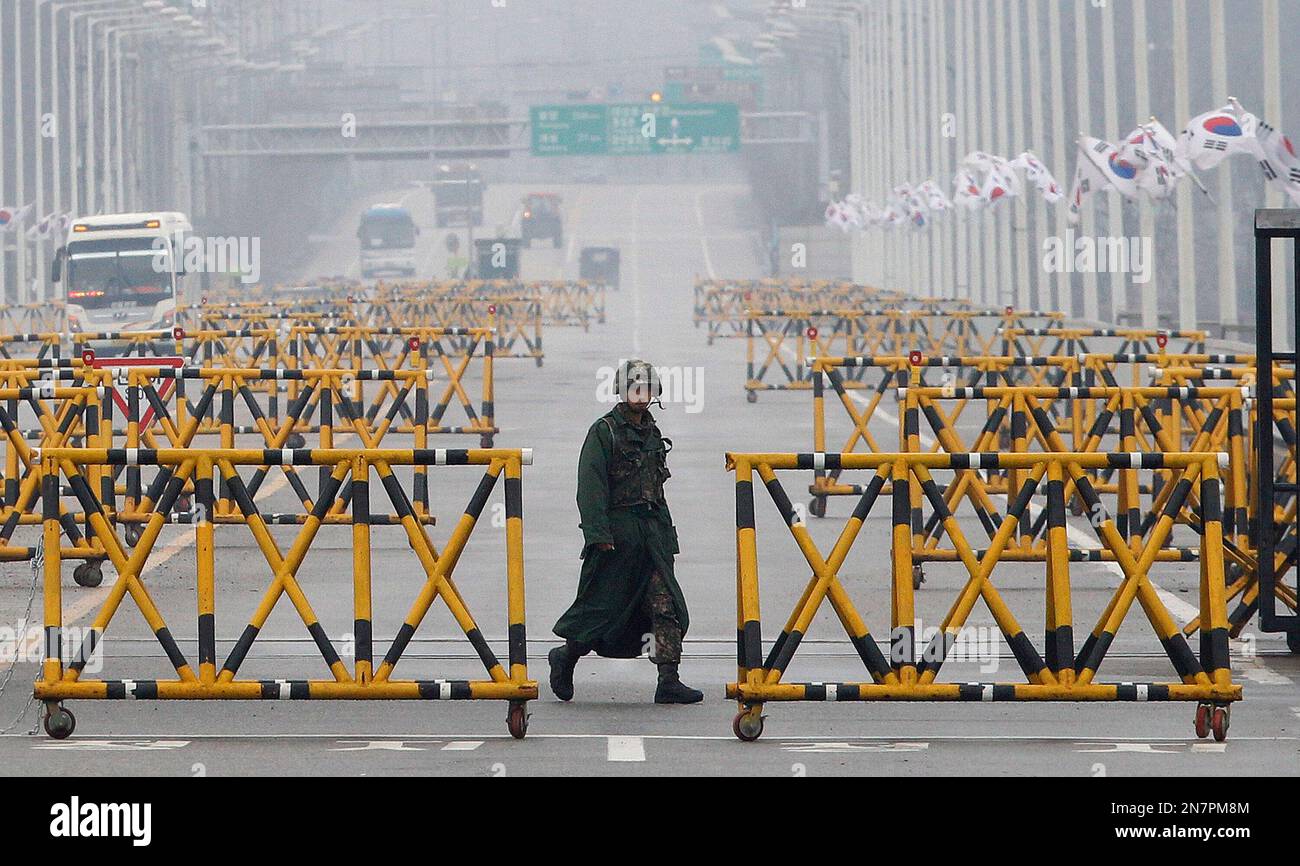 A South Korean Army soldier walks on Unification Bridge in Paju, South ...