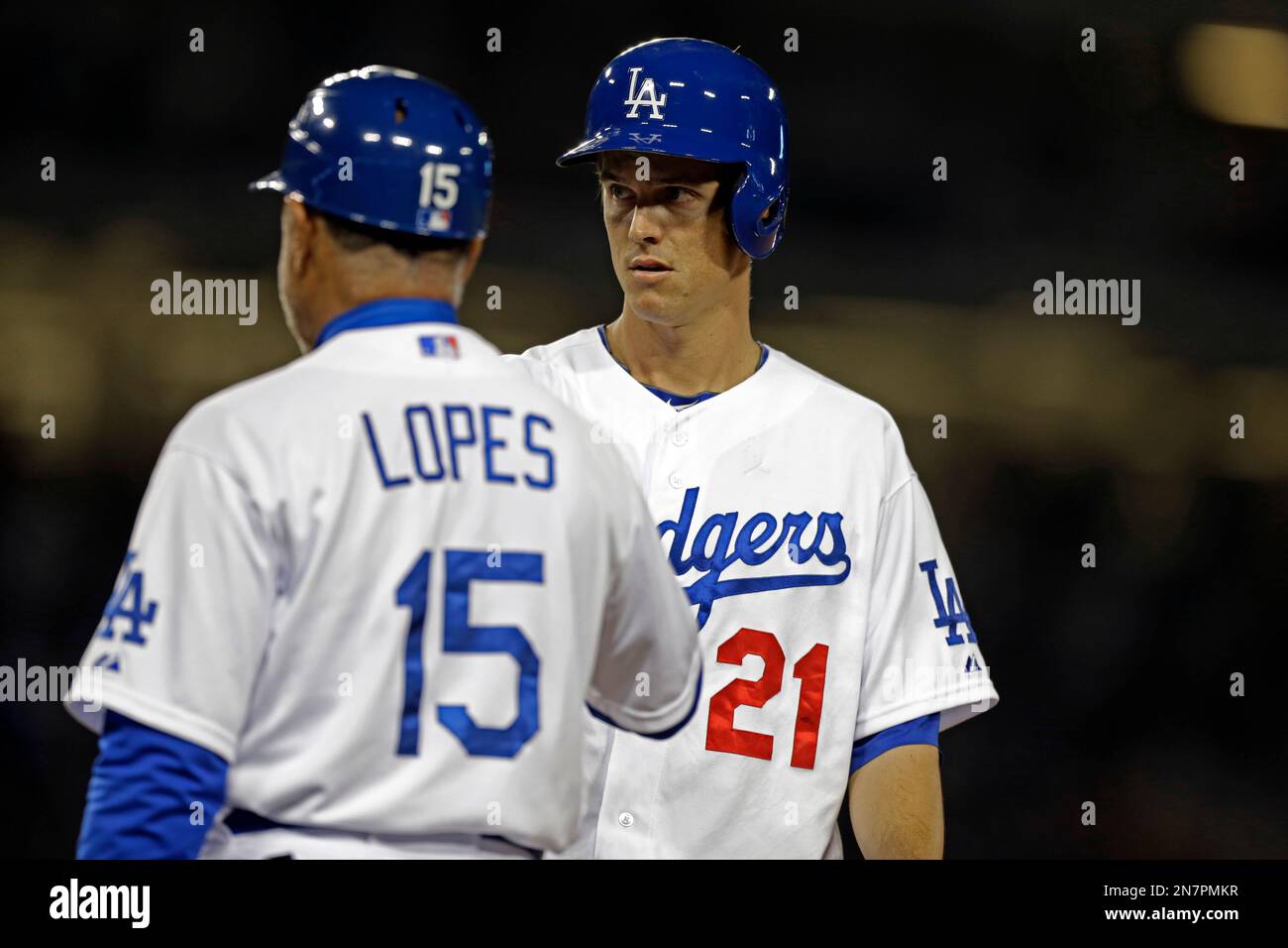 Dodgers Zack Greinke (21) and coach Davey Lopes (15) in a baseball game between the Pittsburgh ...