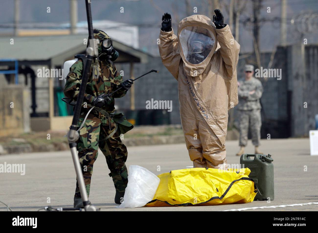 Soldiers of the U.S. Army 23rd chemical battalion, wearing anti ...