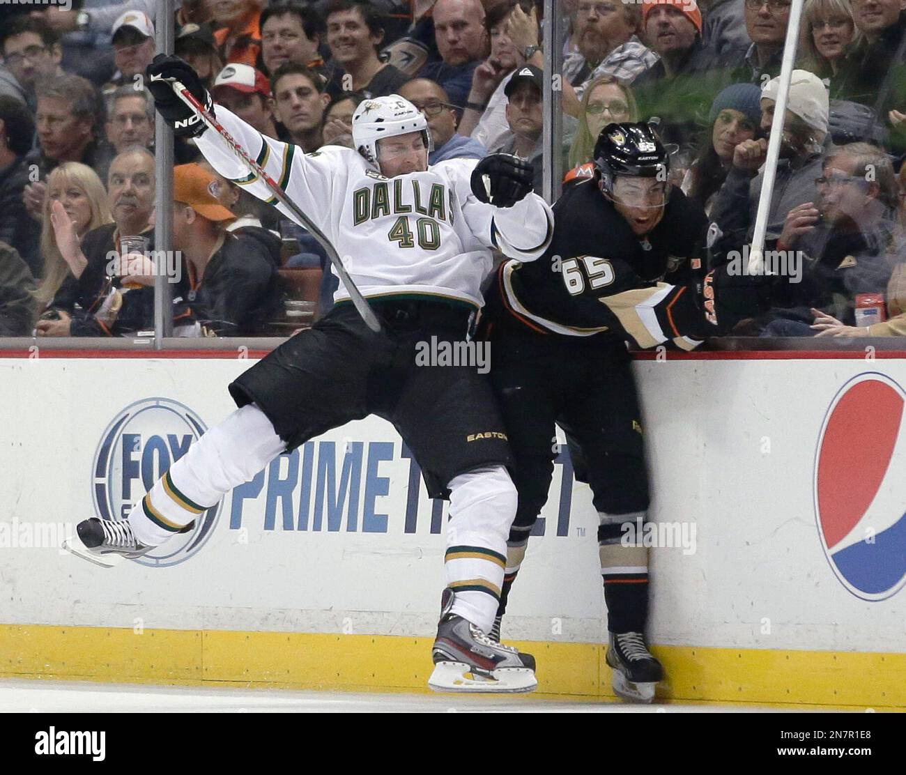 Dallas Stars' Ryan Garbutt, left, checks Anaheim Ducks' Emerson Etem ...